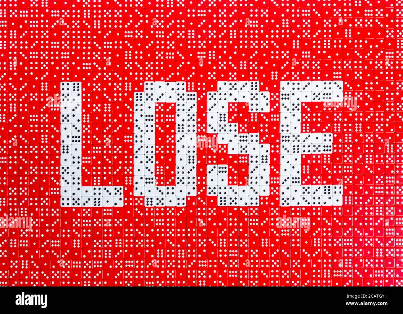 The word LOSE spelled in a field of dice Stock Photo - Alamy