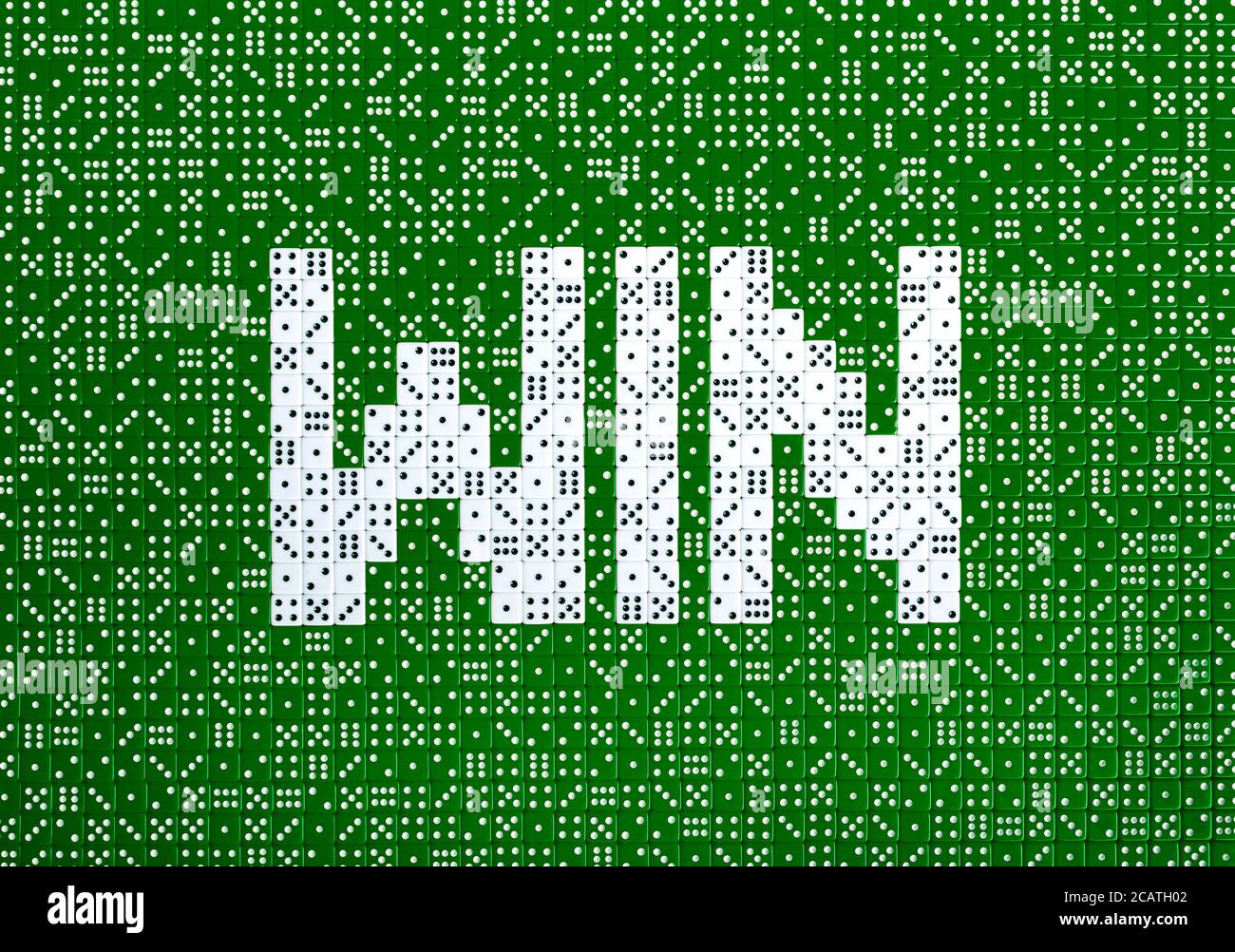 The word WIN spelled in a field of dice Stock Photo - Alamy