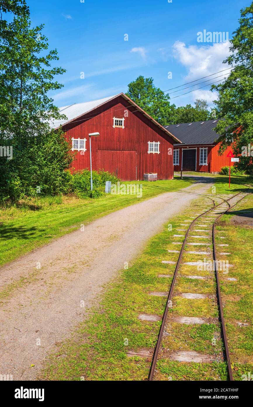 Railroad tracks at old storage buildings in an industrial area Stock ...