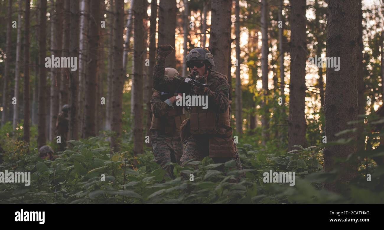 modern warfare soldier officer is showing tactical hand signals to ...