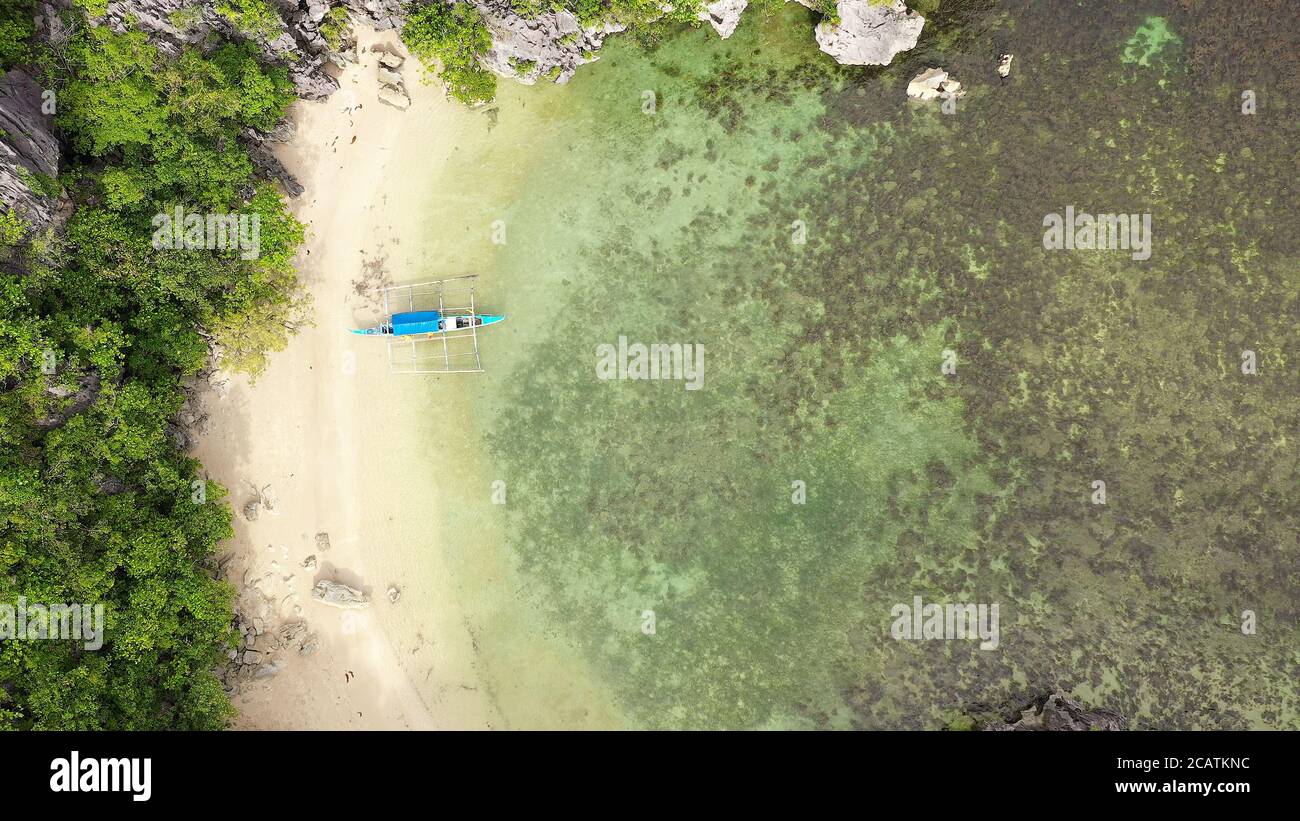 Rocky island with a small white beach, view from above. Kagbalinad ...