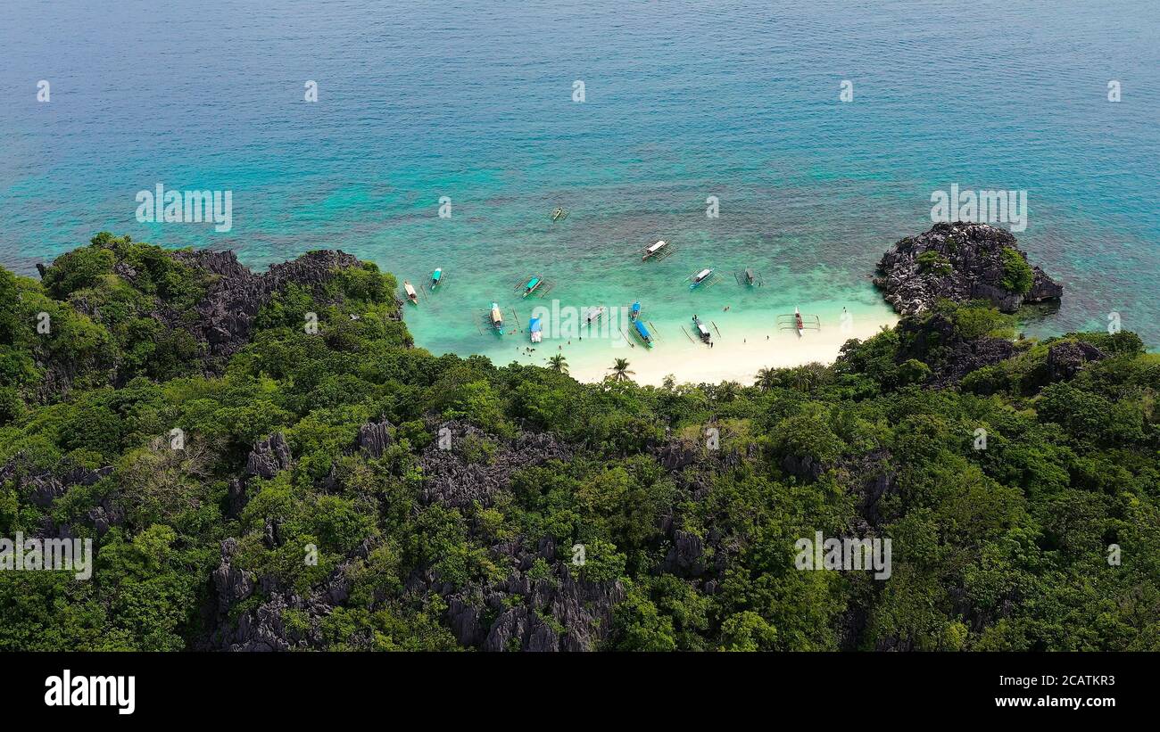 Travel concept: tropical sand beach and turquoise water view from the ...