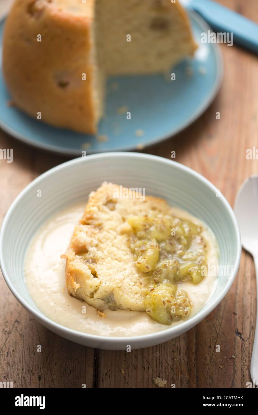 Cooked gooseberry summer pudding with vanilla custard and gooseberry ...