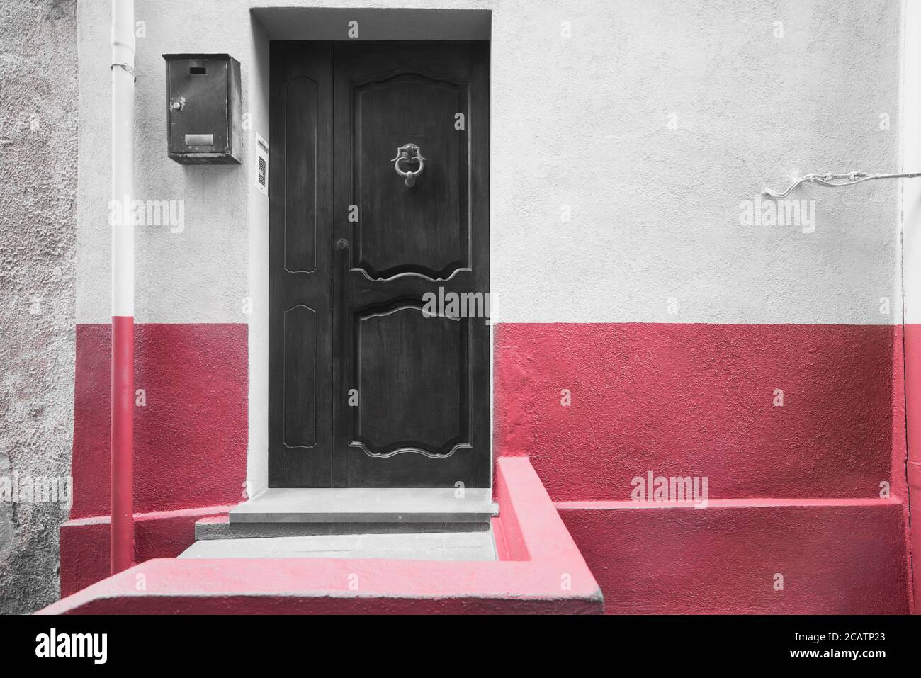 selective desaturation of a red wall in Sardinia Stock Photo - Alamy
