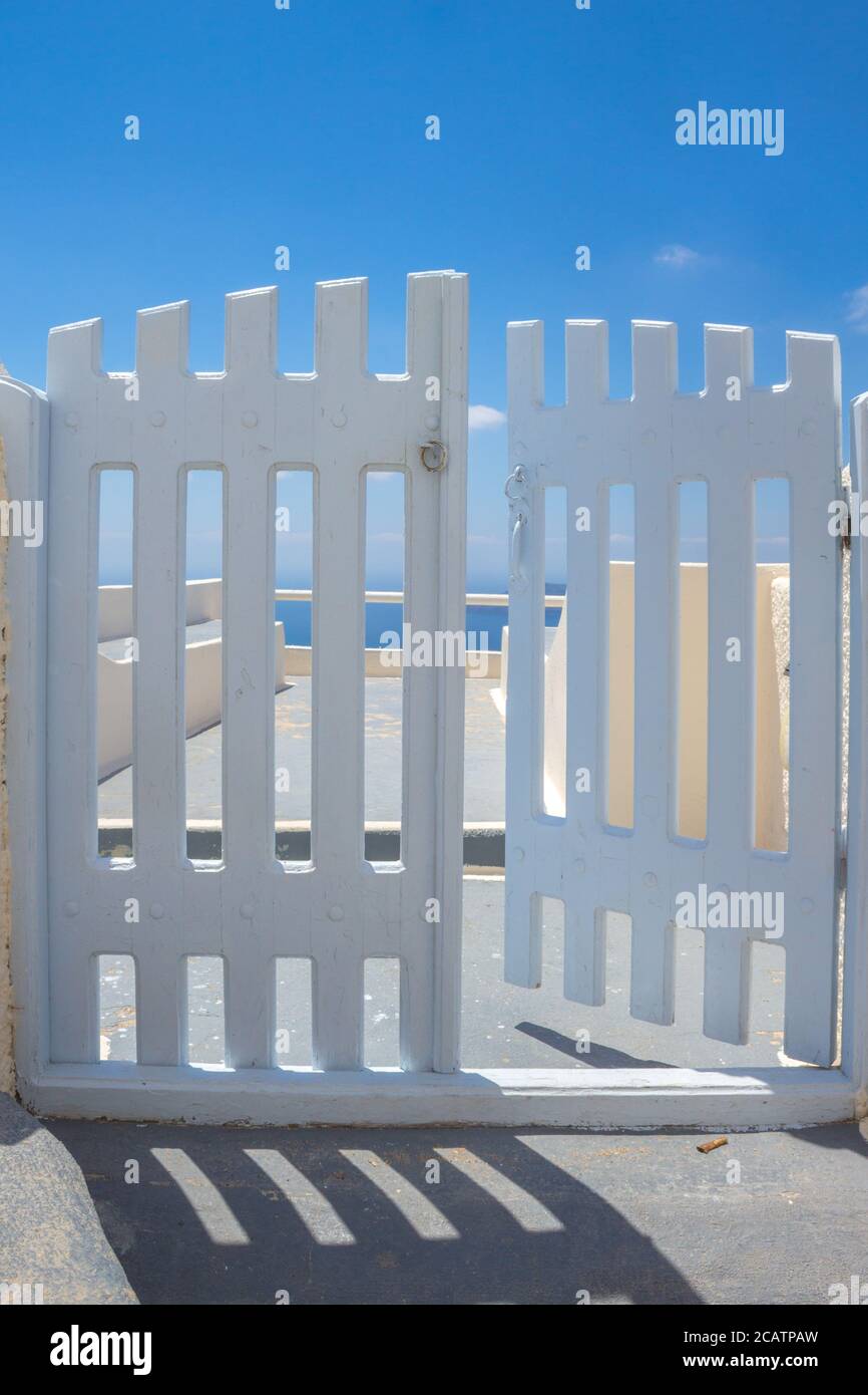 Traditional Greek island architecture, a white gate leading to a ...