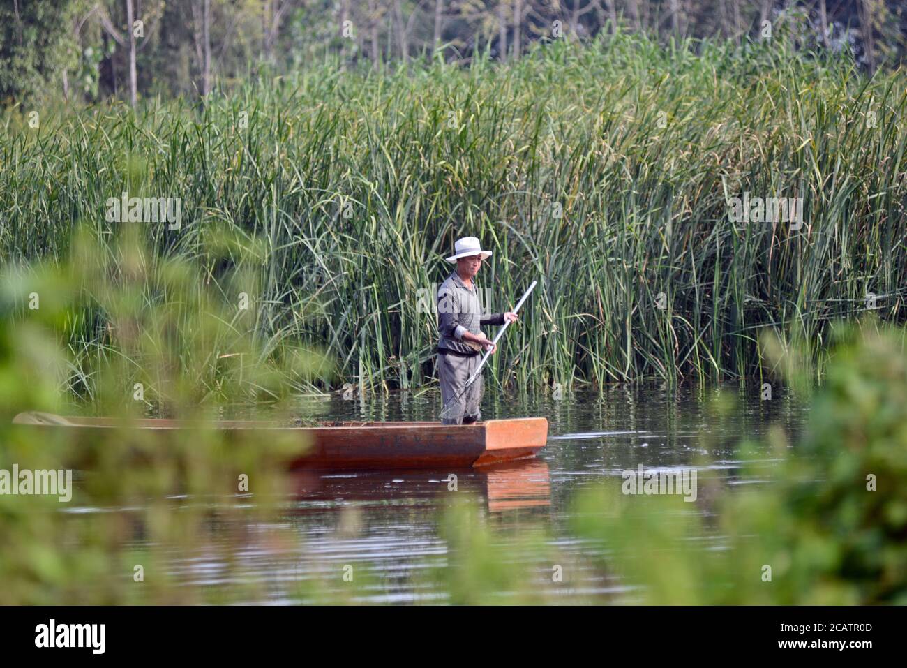 Chinese boat man in East Lake, Wuhan, China Stock Photo - Alamy