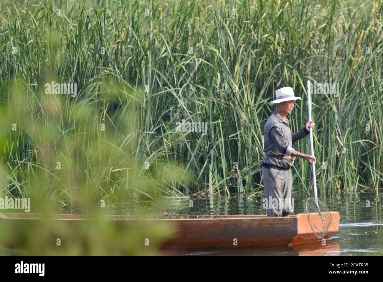 Chinese boat man in East Lake, Wuhan, China Stock Photo - Alamy