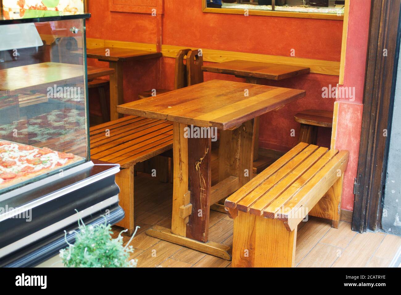 wooden tables and benches in an Italian Pizzeria Stock Photo - Alamy
