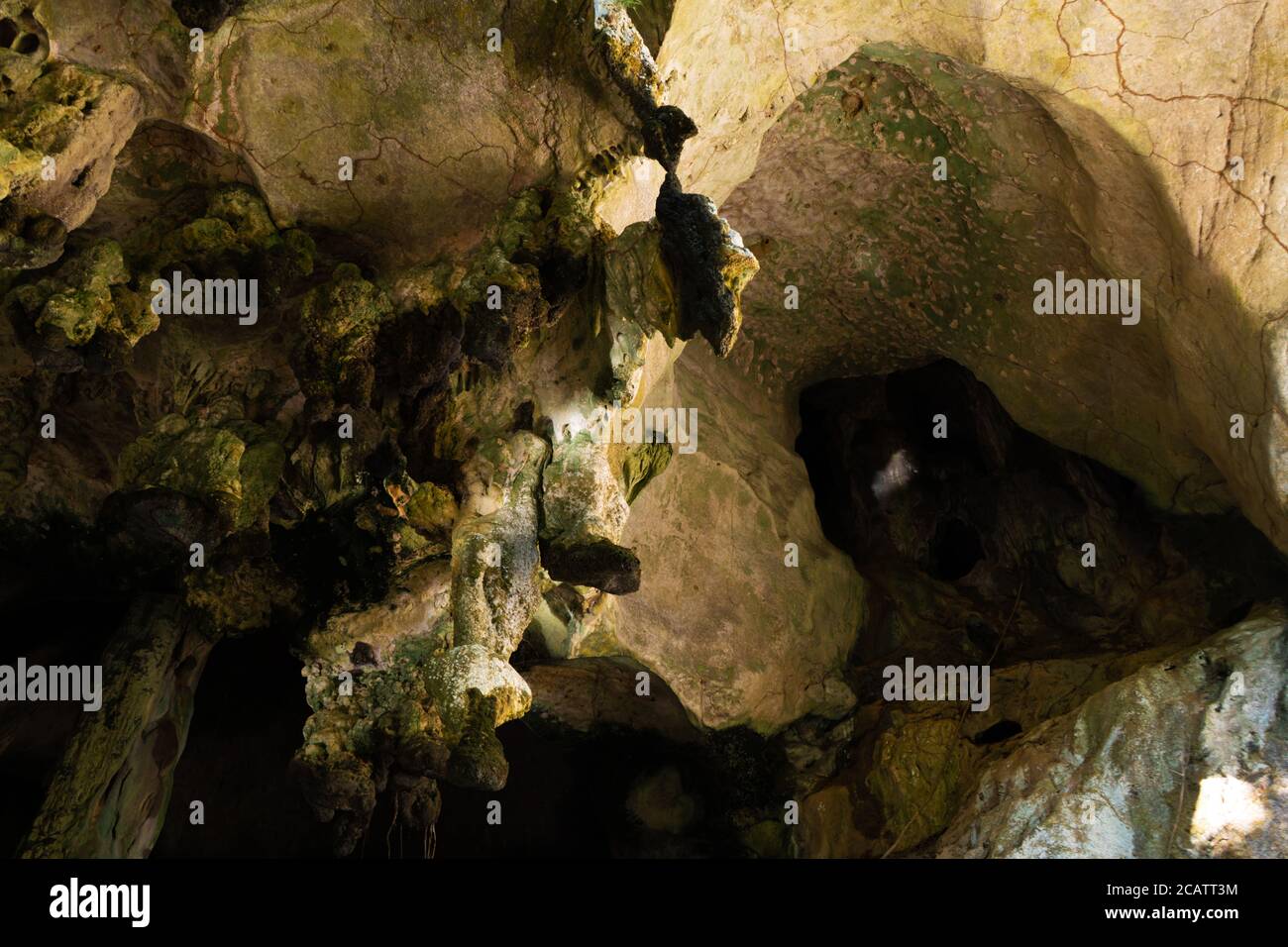 Hike to the cave. Ancient stone cave stalactites and stalagmites Stock ...