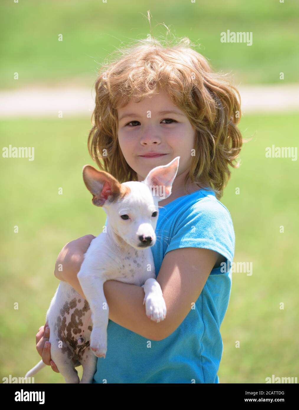 Close up portrait of cute child hugging dog. Little boy hugging a dog ...