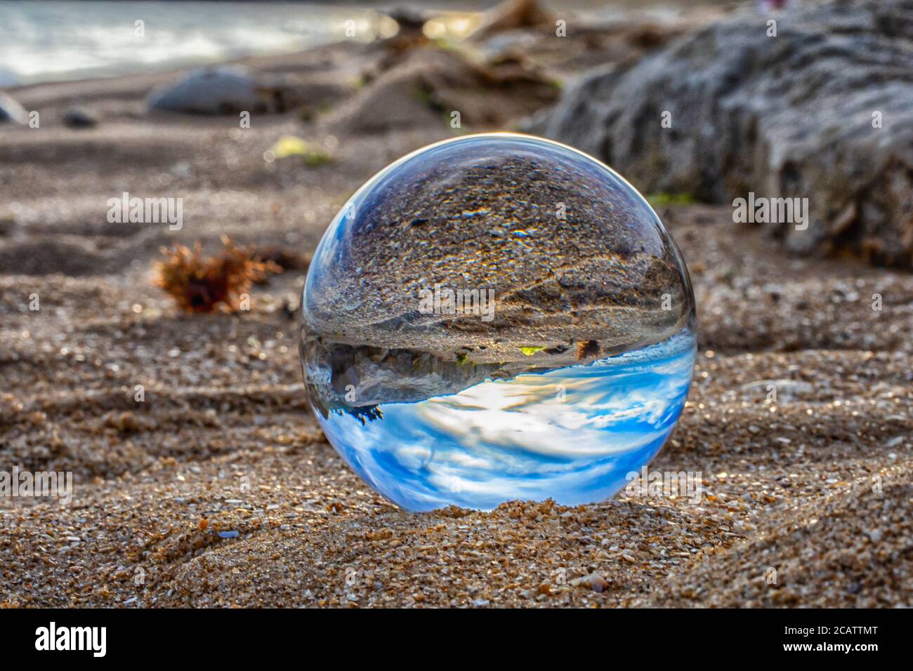 beach seen in a glass ball Stock Photo - Alamy