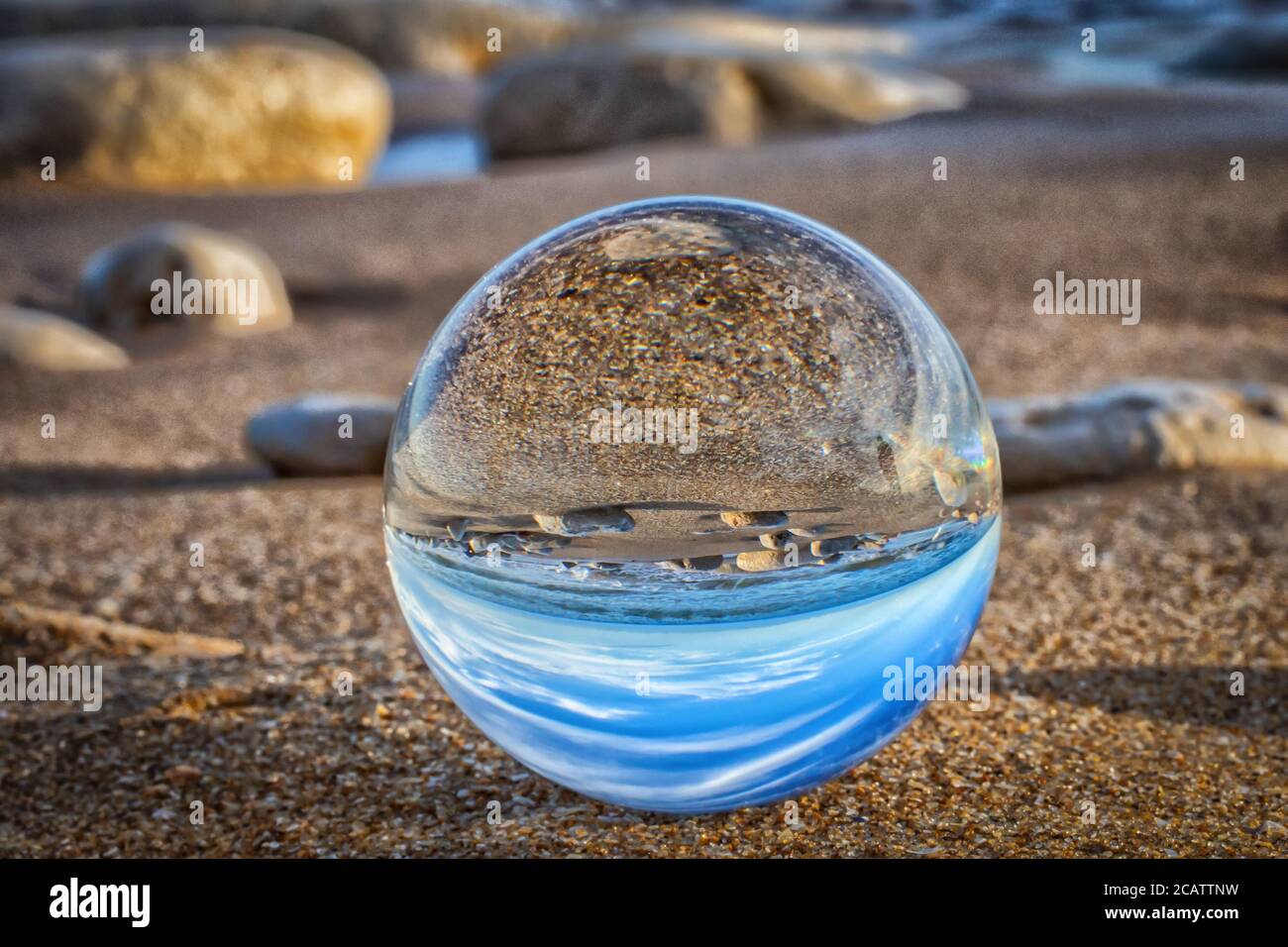 beach seen in a glass ball Stock Photo - Alamy