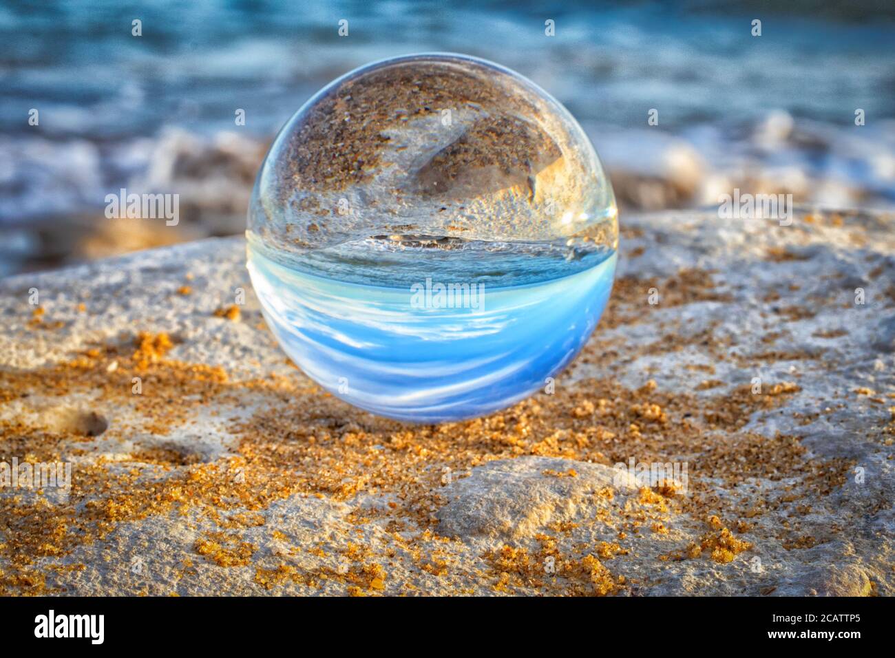 beach seen in a glass ball Stock Photo - Alamy