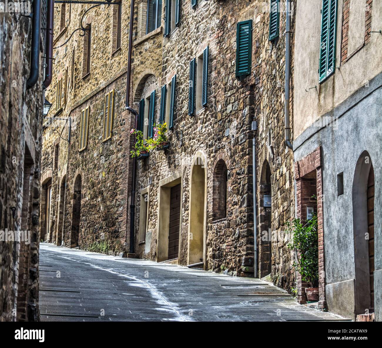 narrow street in Montalcino, Italy Stock Photo - Alamy