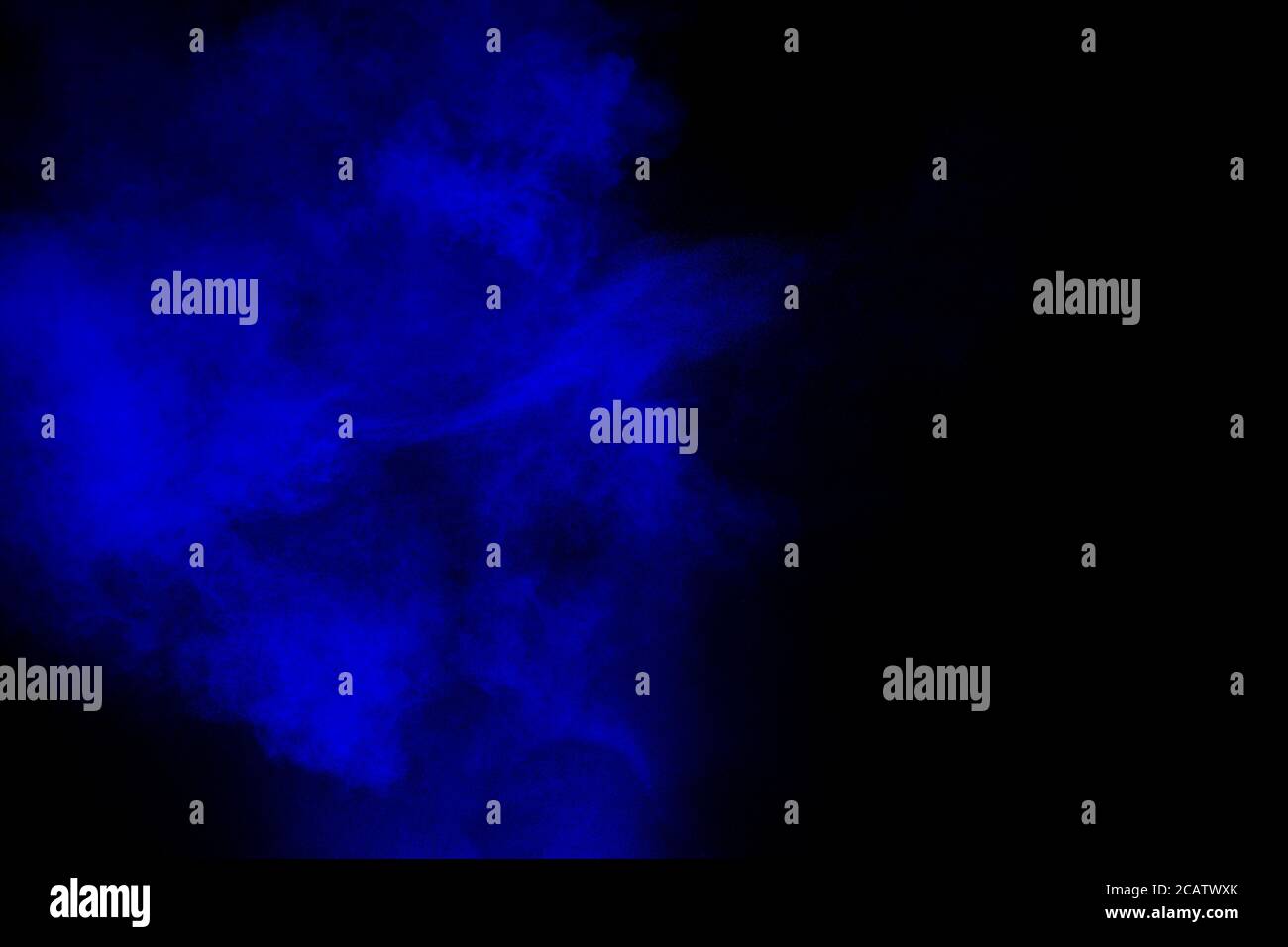 Abstract blue powder explosion cloud on dark background Stock Photo - Alamy