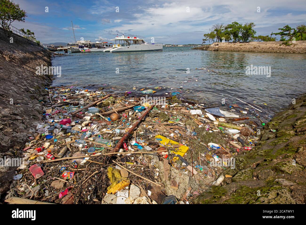 A harbor in Cebu filled with plastic floating trash, Philippines Stock ...