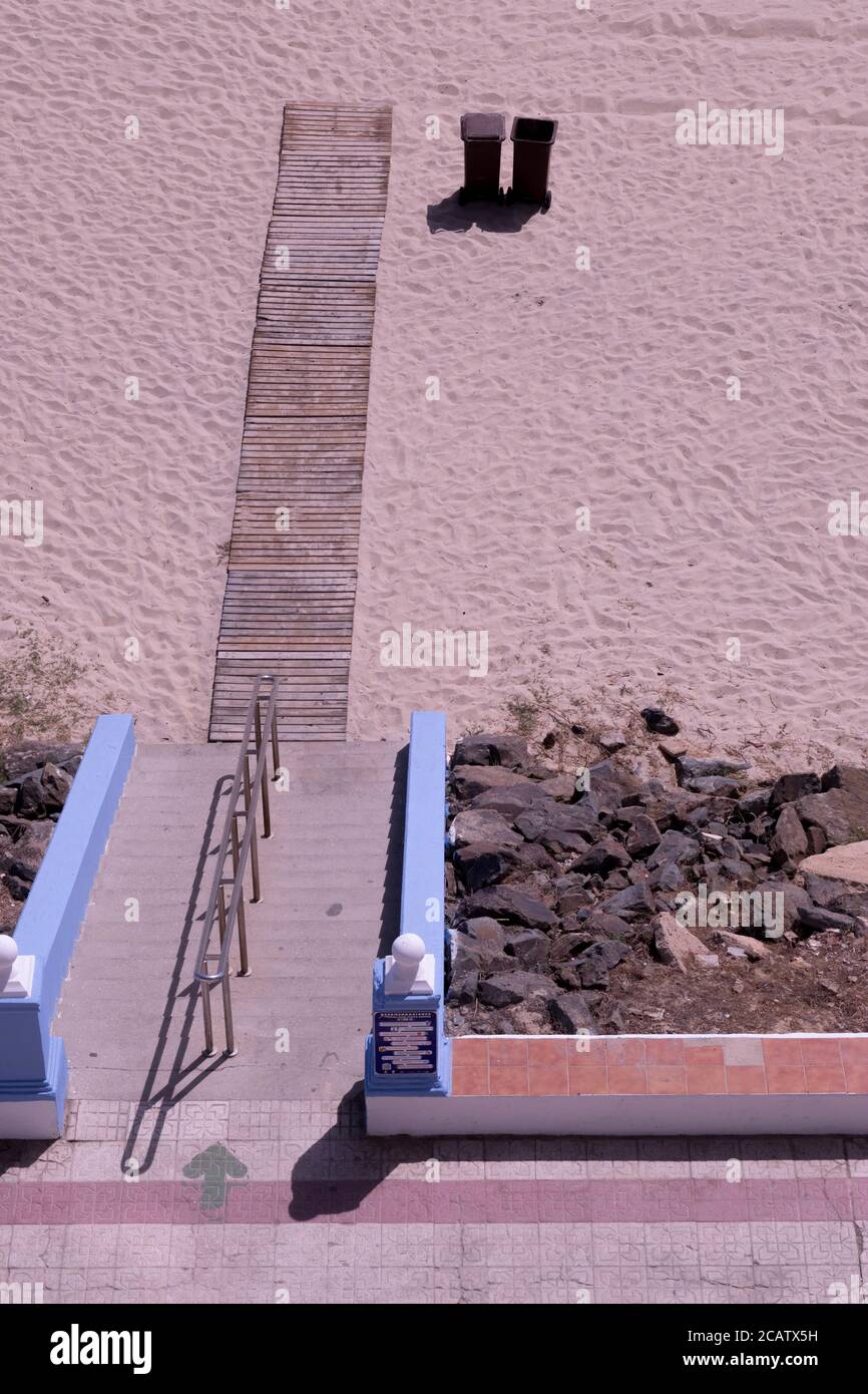 Vertical shot of a sandy beach with stairs Stock Photo - Alamy