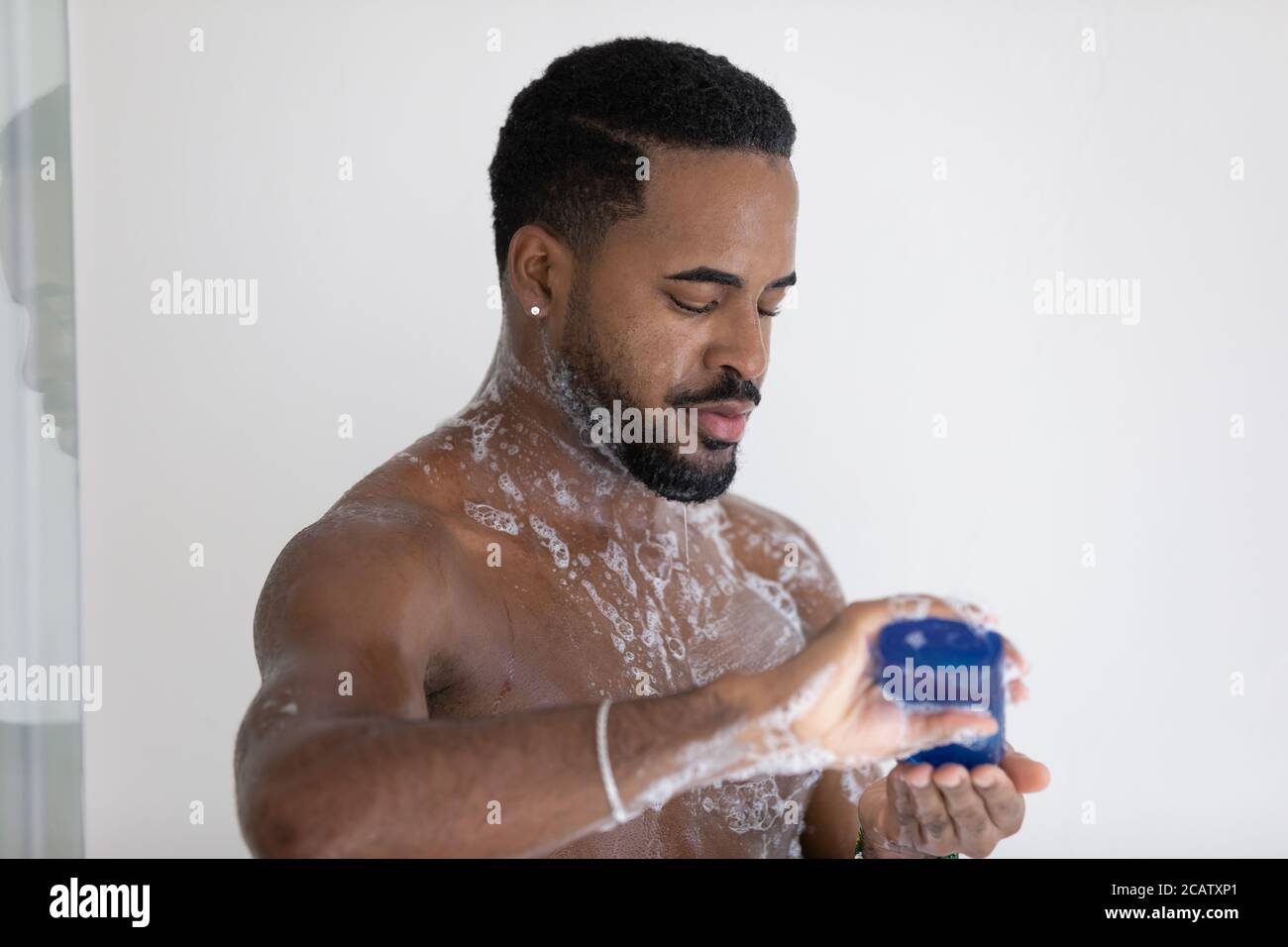 Close Up Handsome African American Man Taking Shower With Gel Stock