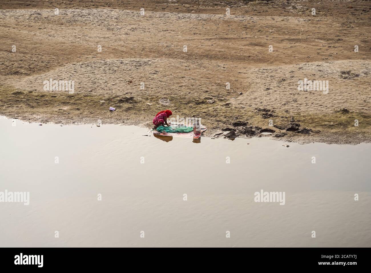Indian woman washing clothes by hand hi-res stock photography and images - Alamy