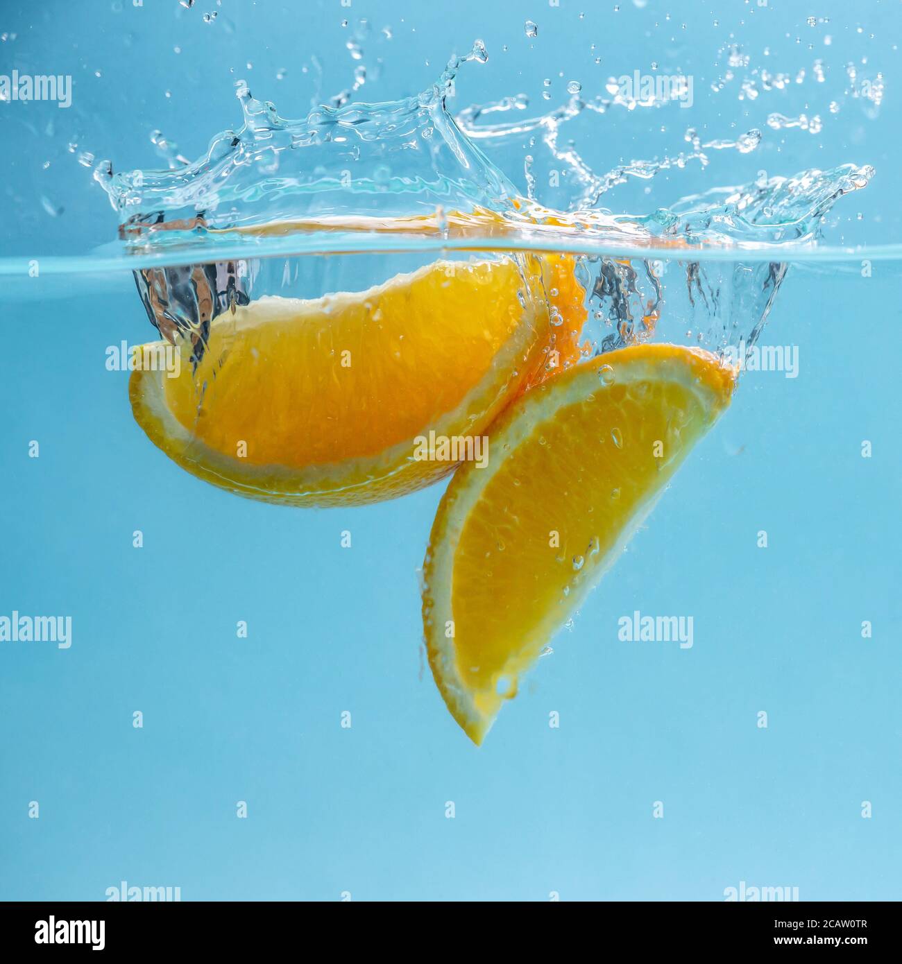 Orange slice splash in transparent hi-res stock photography and images ...