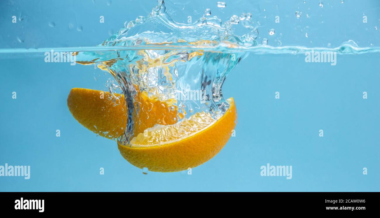 Orange slice splash in transparent hi-res stock photography and images ...