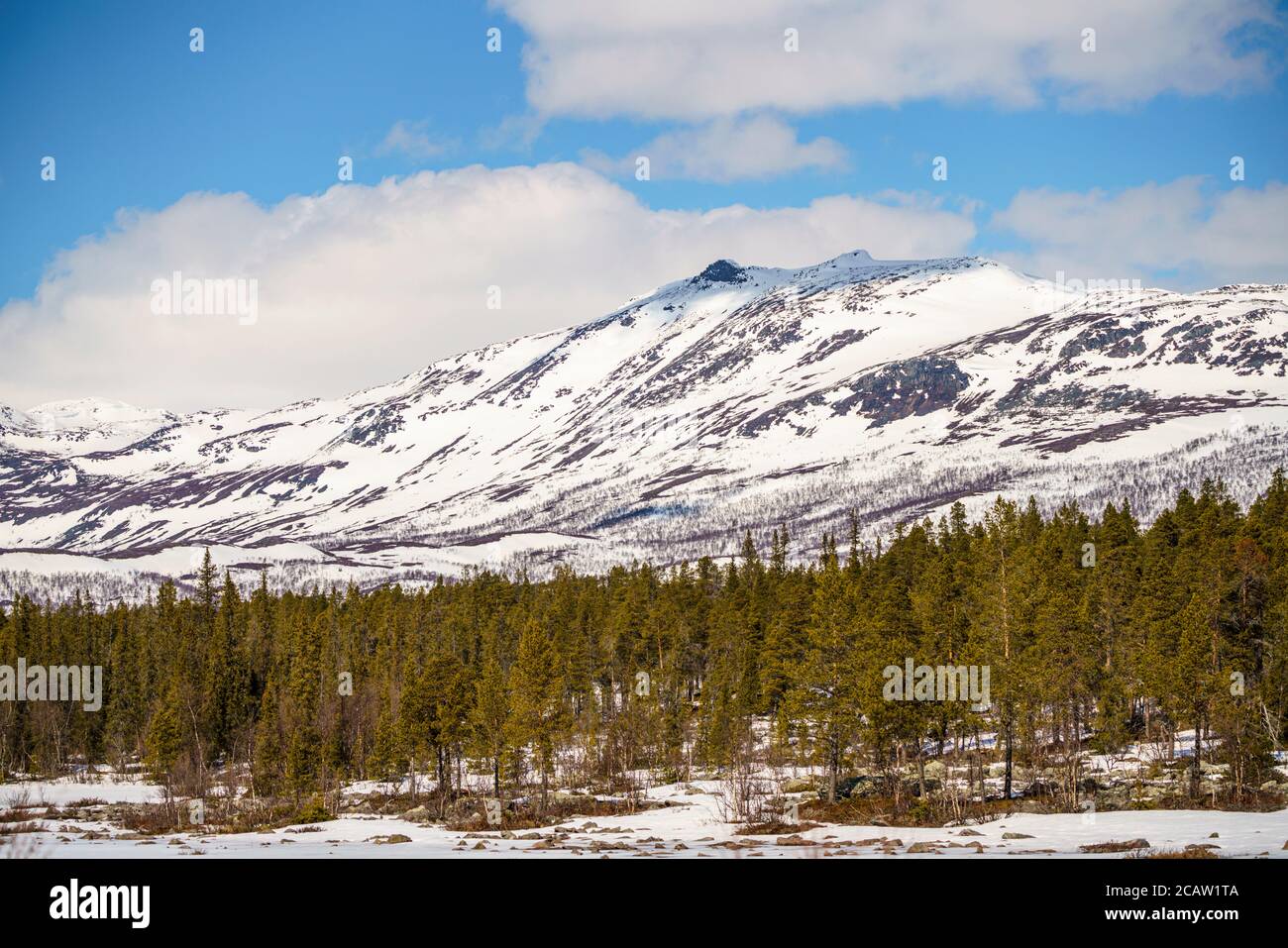 Snowy landscape in spring time with mountains in background, Stora ...