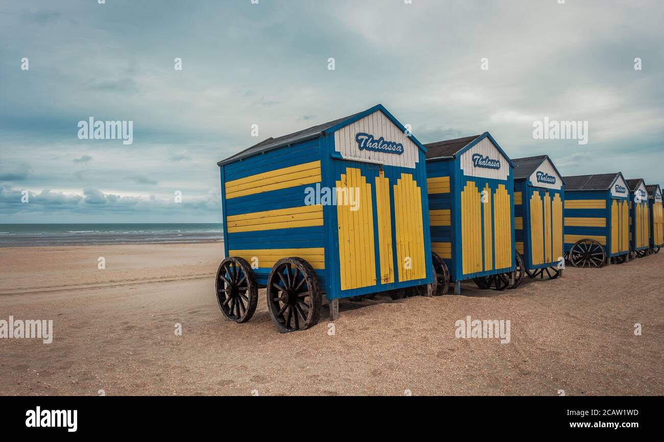 Line-up of vintage beach huts on wheels Stock Photo - Alamy