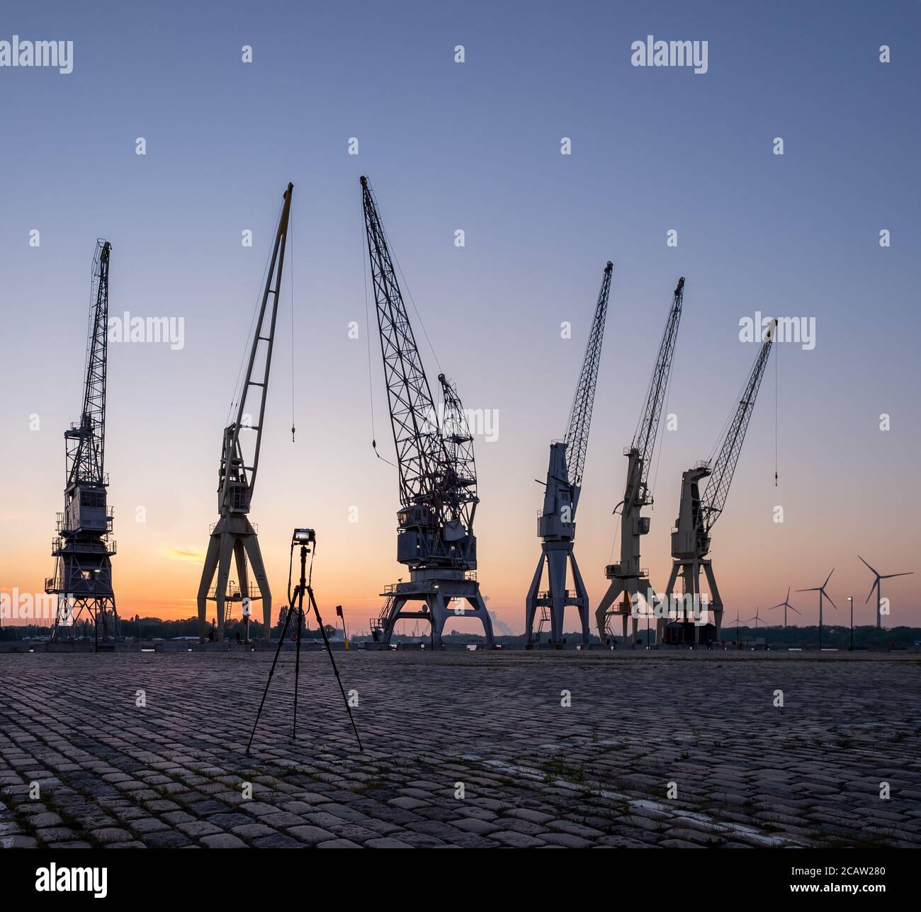 Line-up of historical cranes in the old part of the port of Antwerp ...