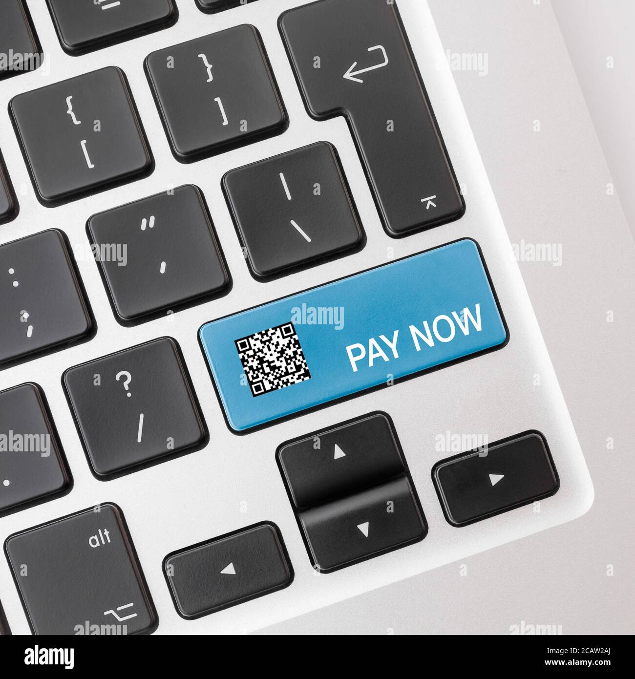 QR code on a computer keyboard with text Pay Now Stock Photo - Alamy