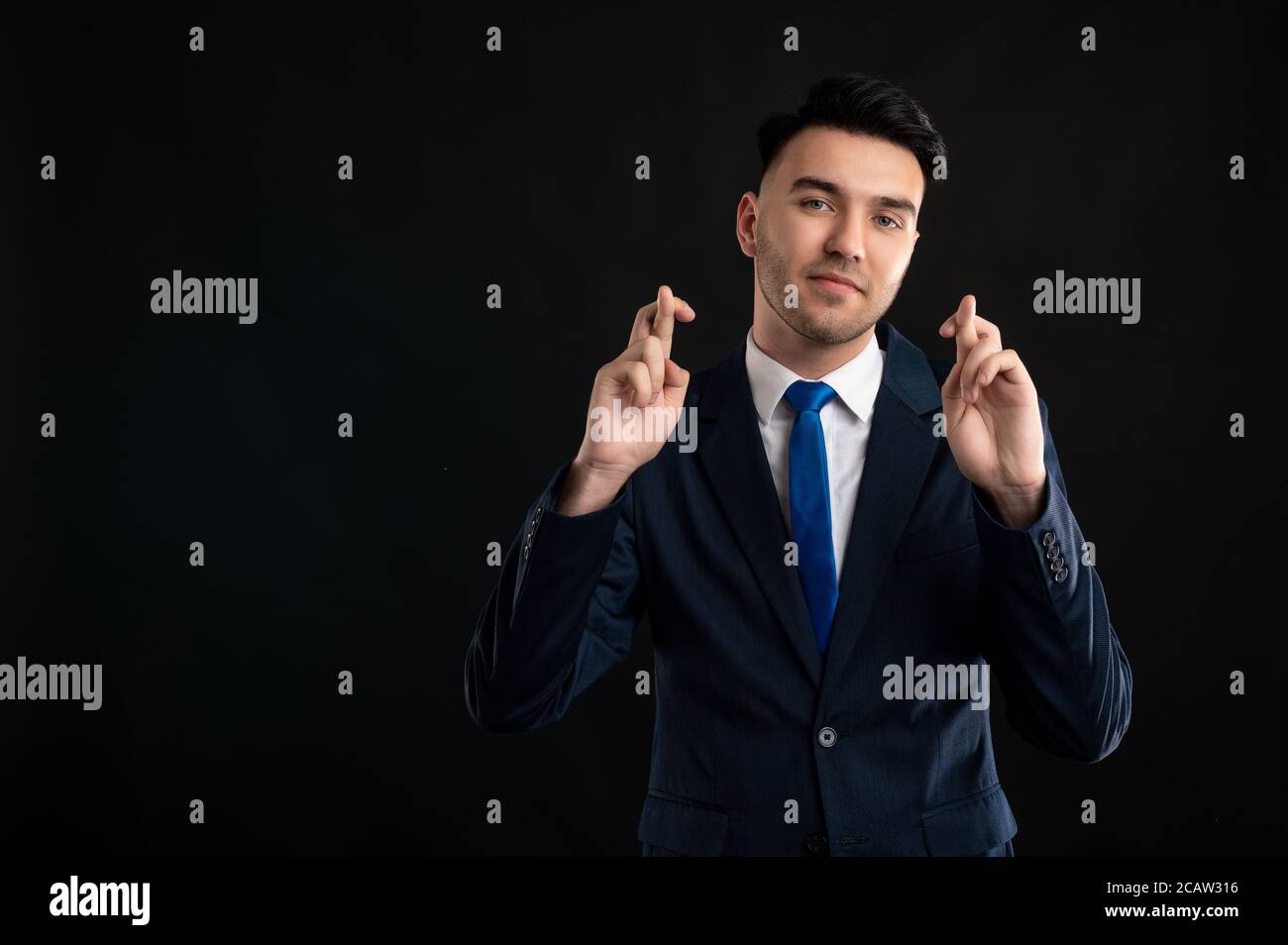 Portrait of business man wearing blue business suit and tie showing ...