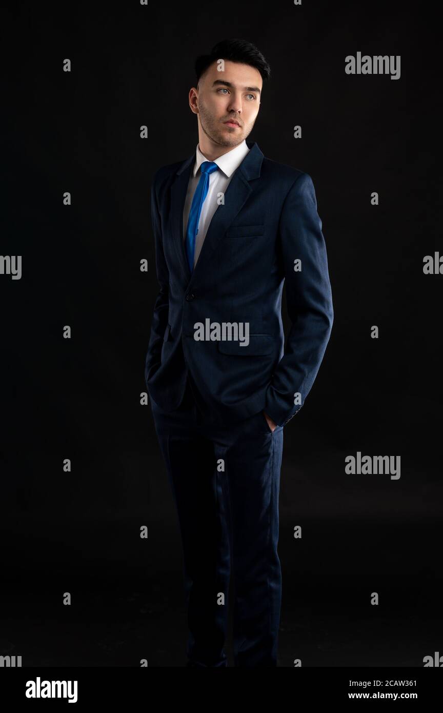 Portrait of business man wearing blue business suit and tie isolated on ...