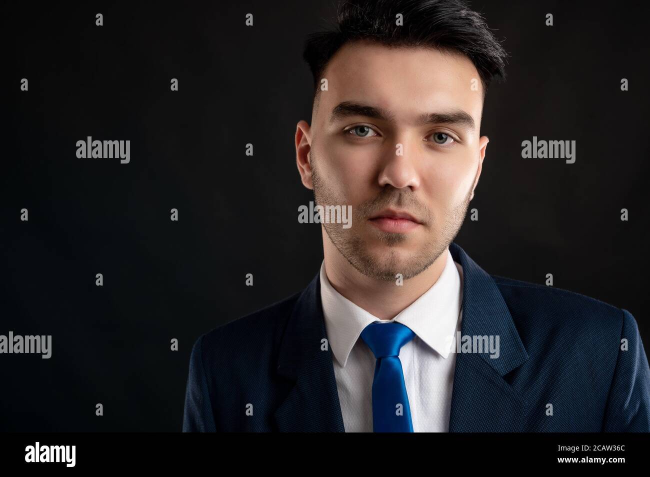 Close-up portrait of business man wearing blue business suit and tie ...