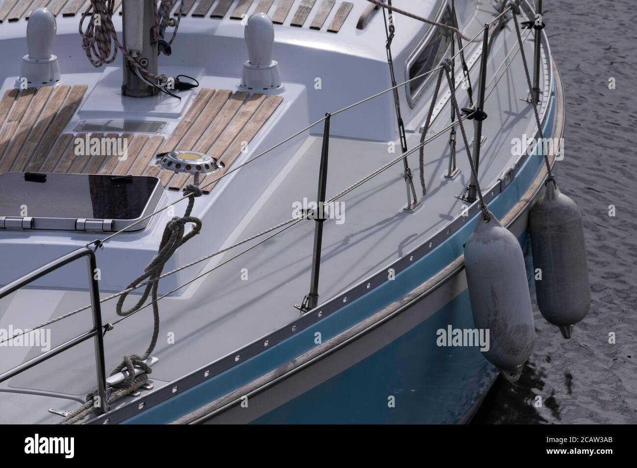 Fenders hanging next to a luxury sailing yacht to protect it when ...