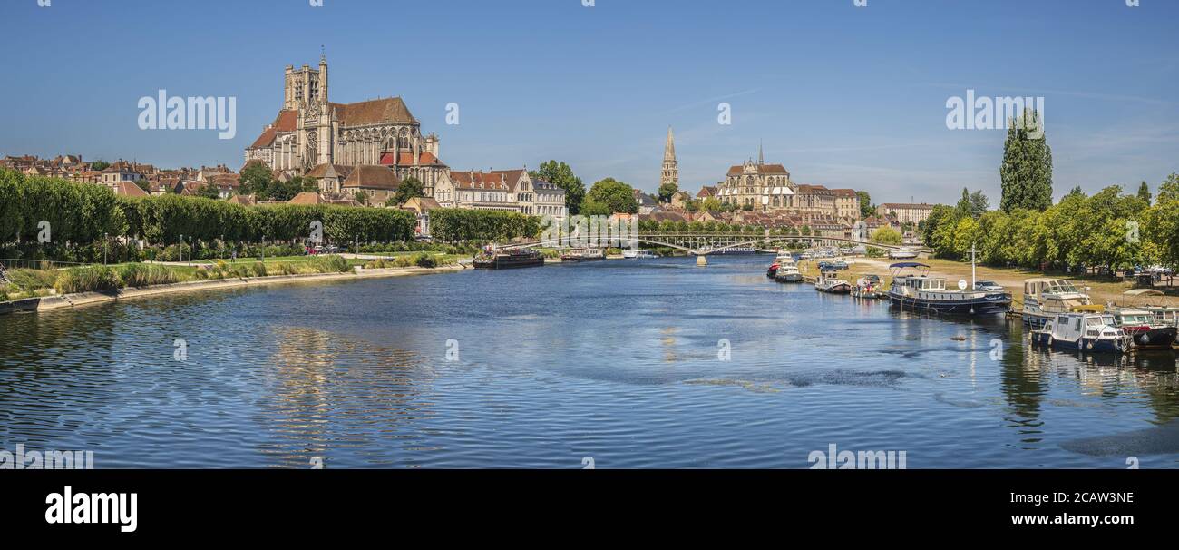 Beautiful shot of the Auxerre Cathedral near the Yonne river on a sunny ...