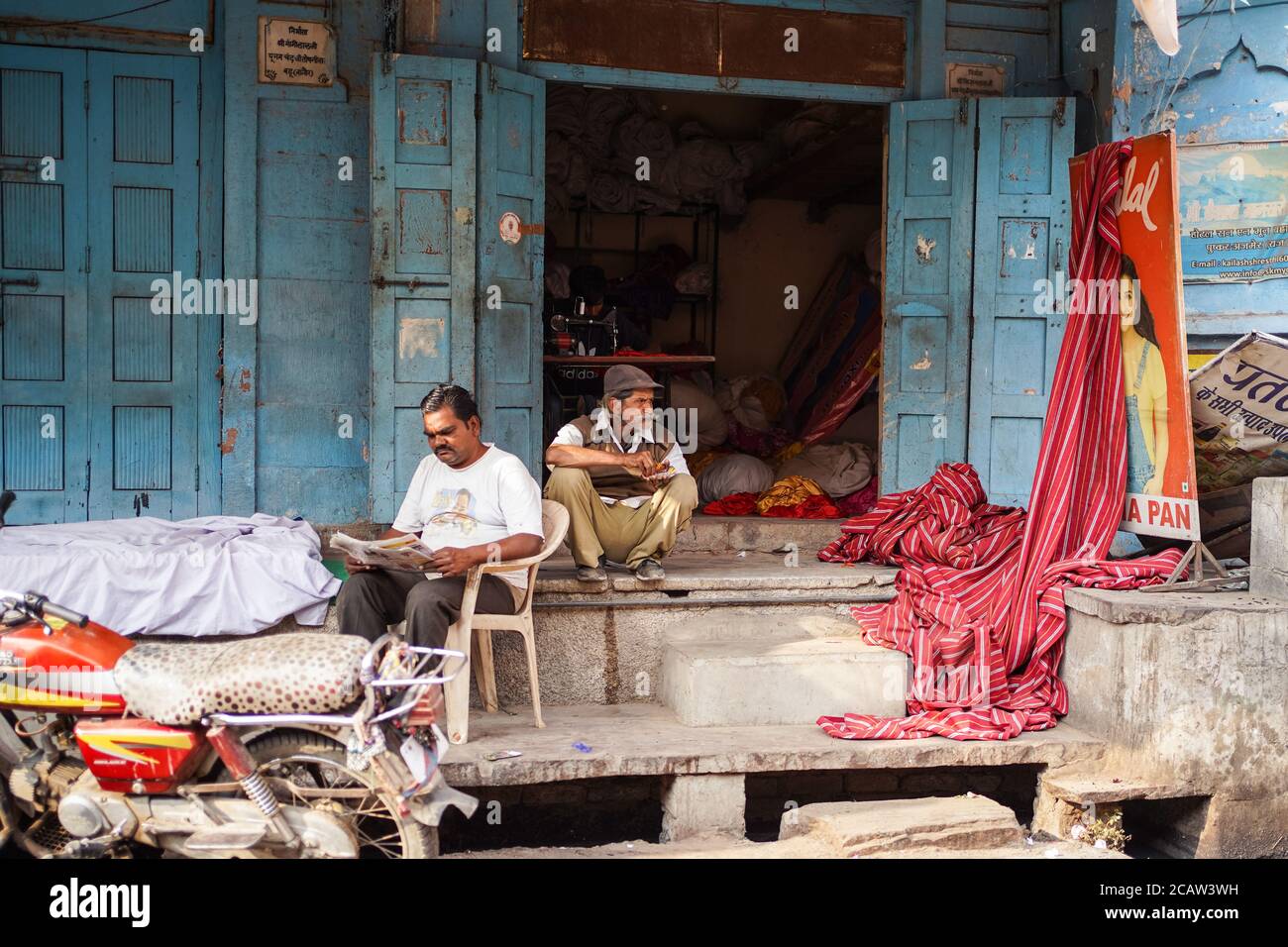 Indian men sitting in shop hi-res stock photography and images - Alamy
