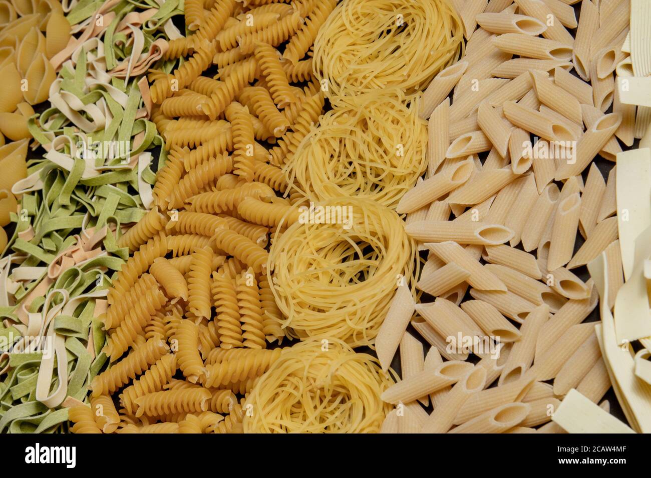 Variety of types and shapes of dry Italian pasta. Italian Macaroni raw ...