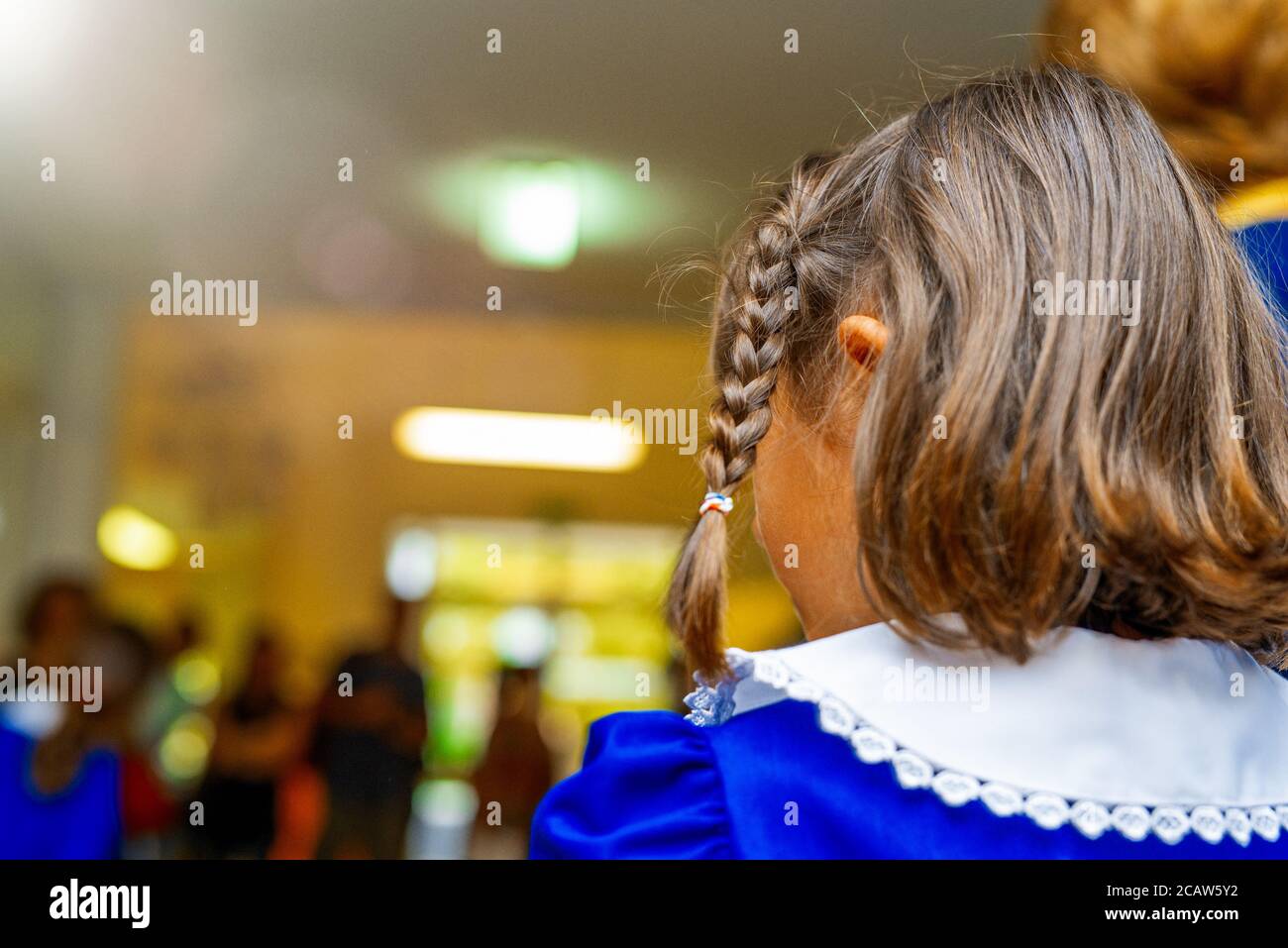 Young girl on her first day of elementary school, back view Stock Photo ...