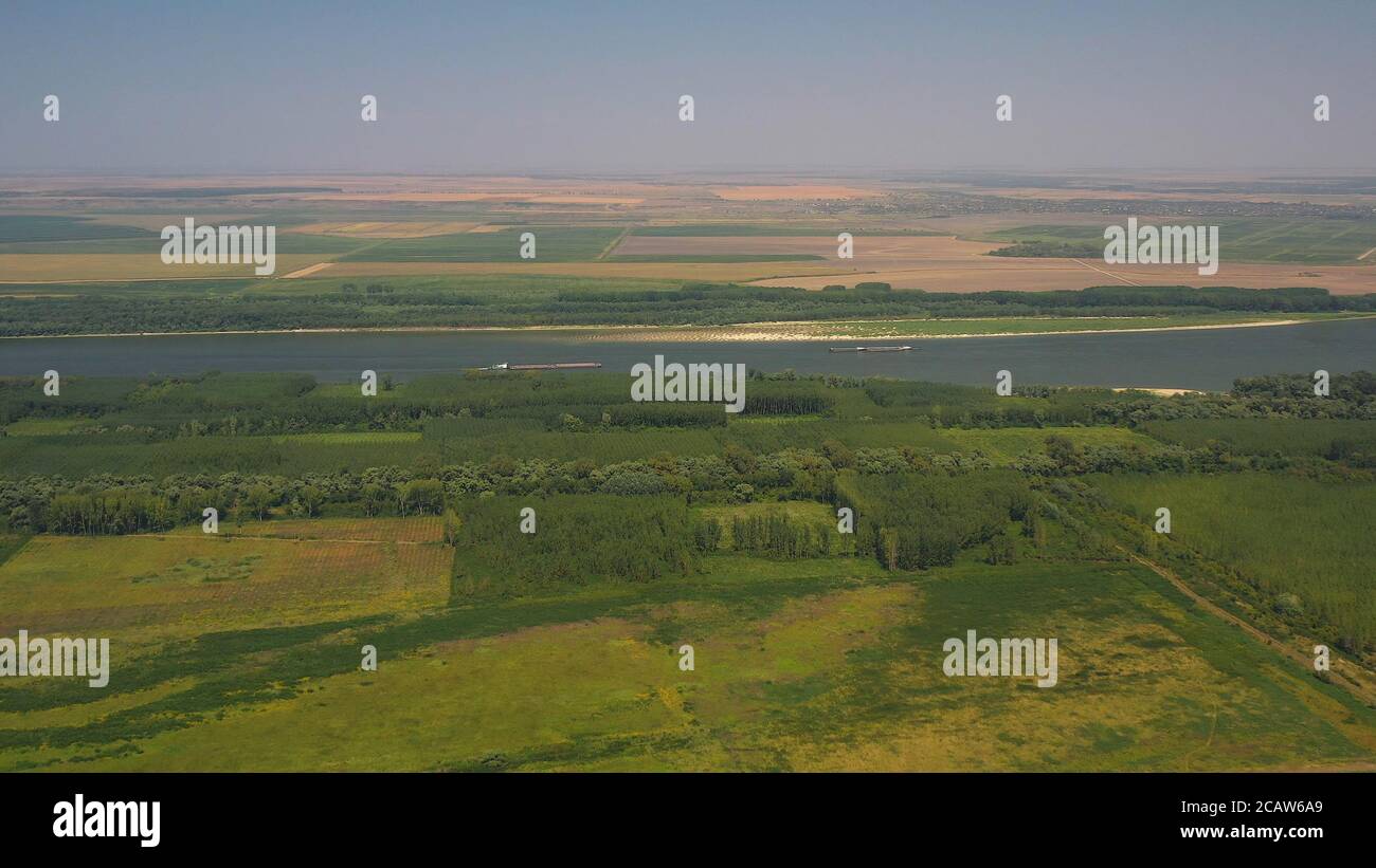 Aerial shot of a land covered in greens and a long river Stock Photo ...