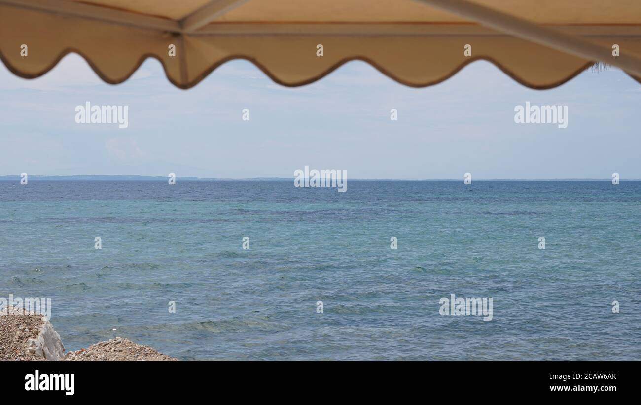 Wavy blue ocean gleaming under the blue sky Stock Photo - Alamy