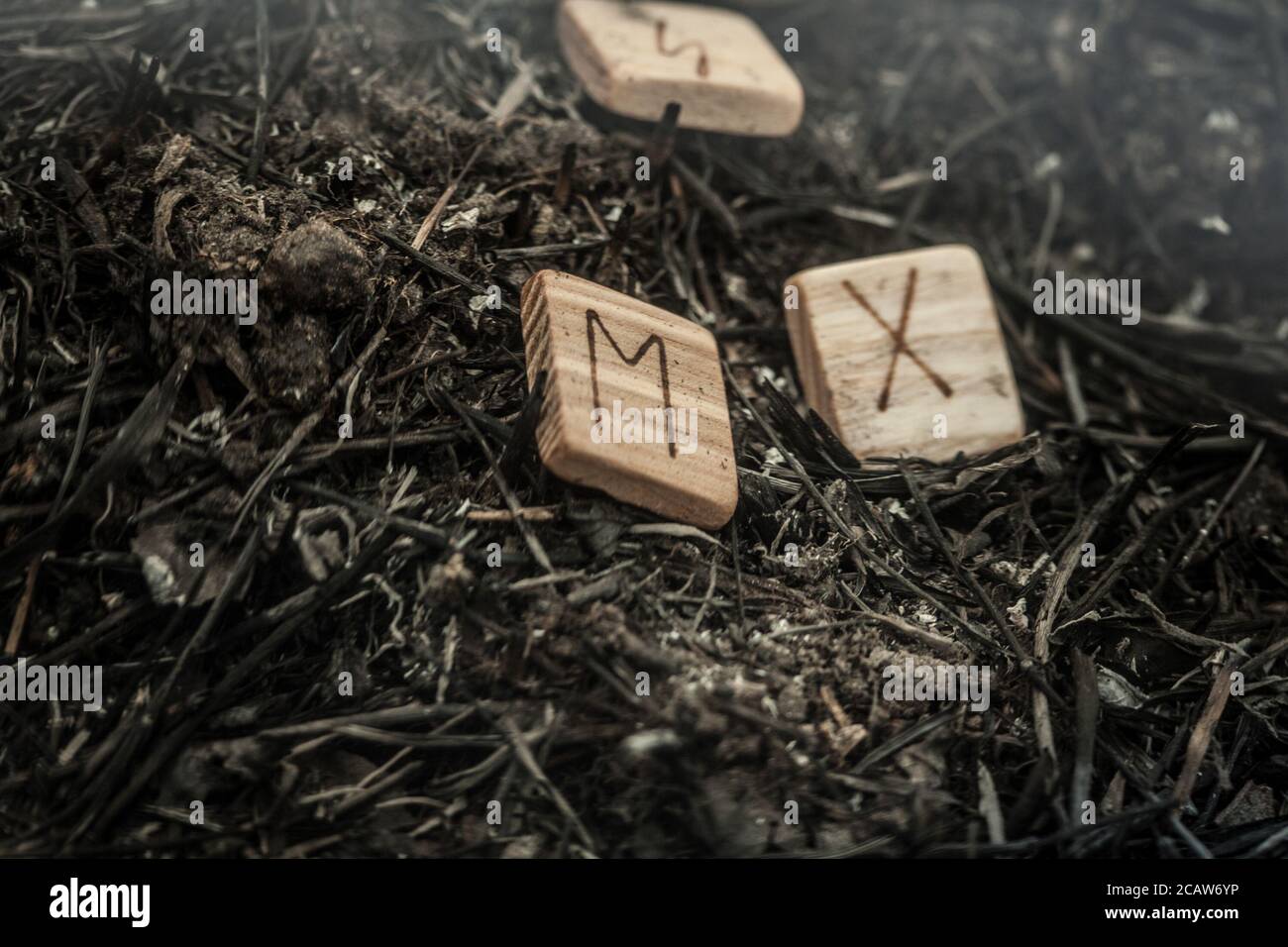 wooden runes on the ground Stock Photo - Alamy