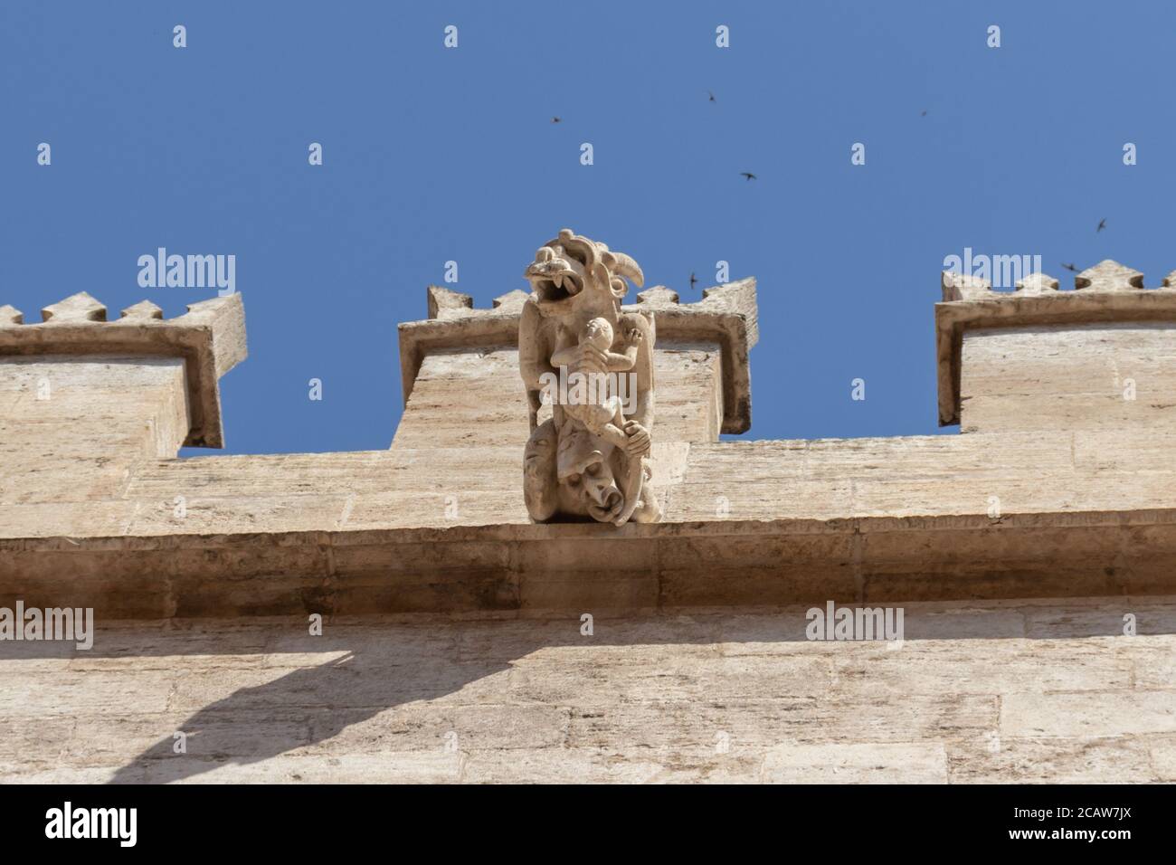 Gothic gargoyle bas relief on an ancient historical building in ...