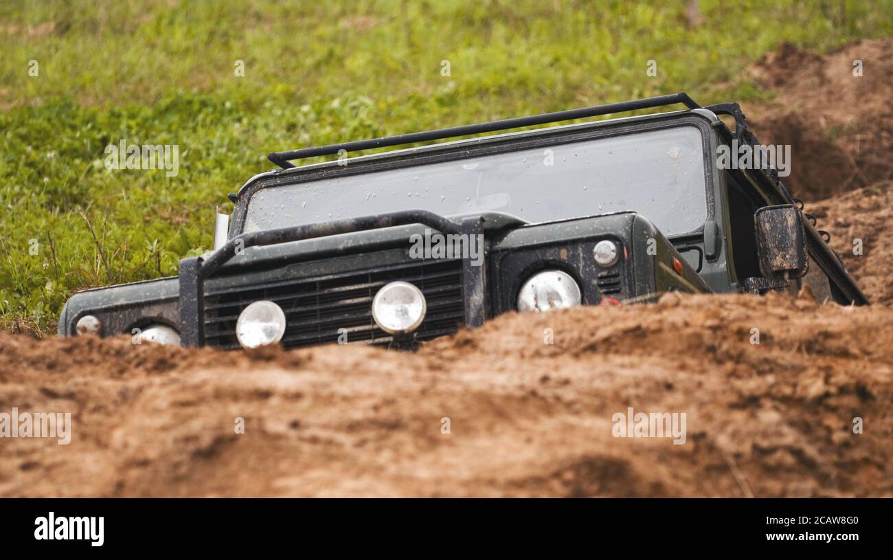 Truck covered with dirt and mud during the safari Stock Photo - Alamy