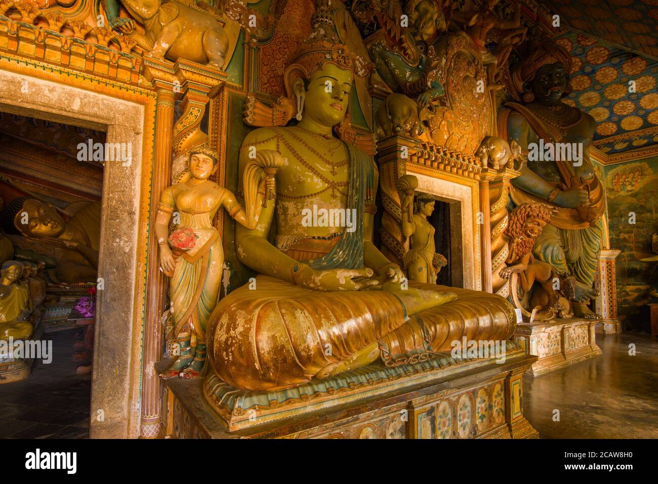At the ancient sculpture of the seated Buddha. Fragment of the interior ...