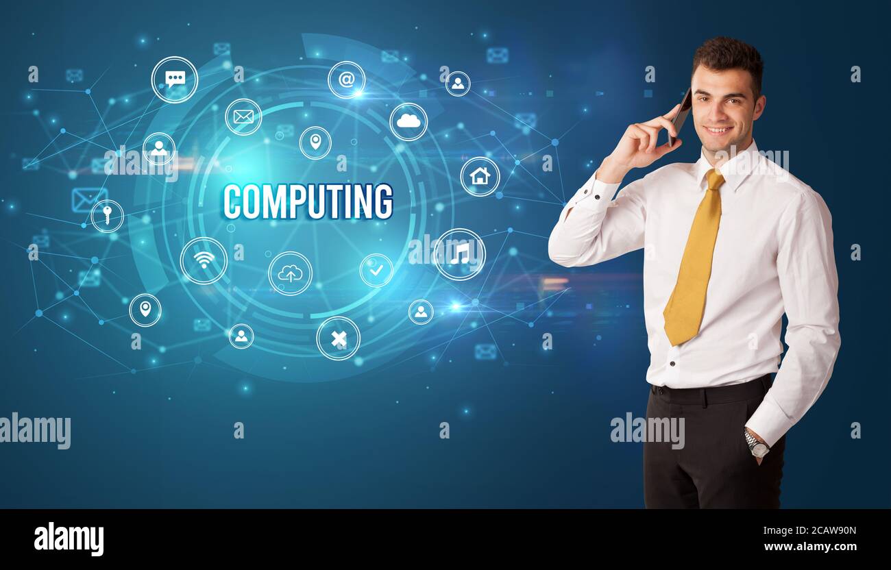 Businessman thinking in front of technology related icons and COMPUTING ...