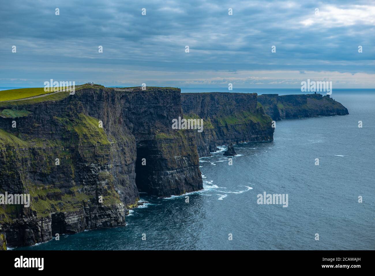 Cliff of Moher, at the coast of Ireland, on a cloudy day Stock Photo ...