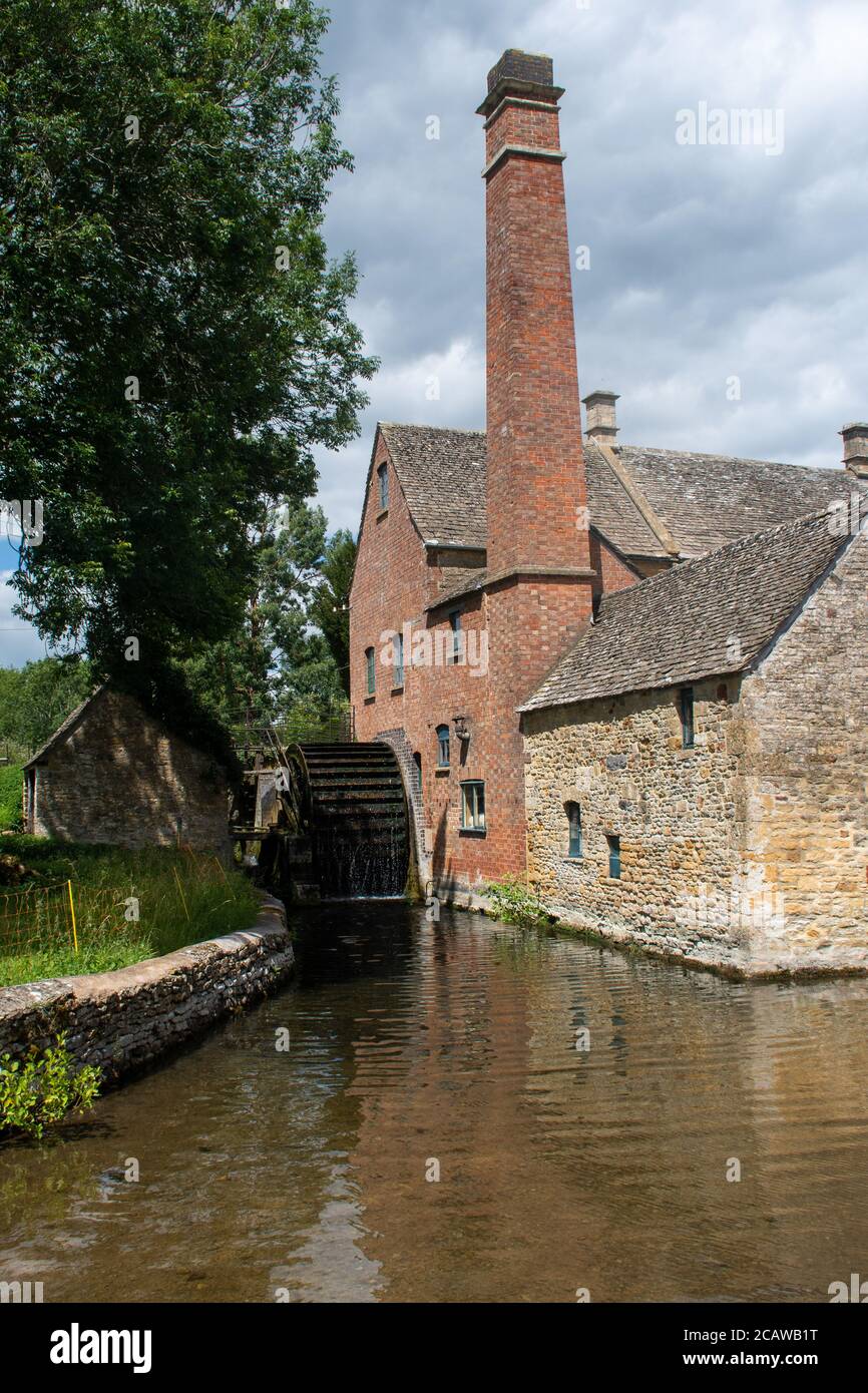 Traditional English Watermill by stream Stock Photo - Alamy