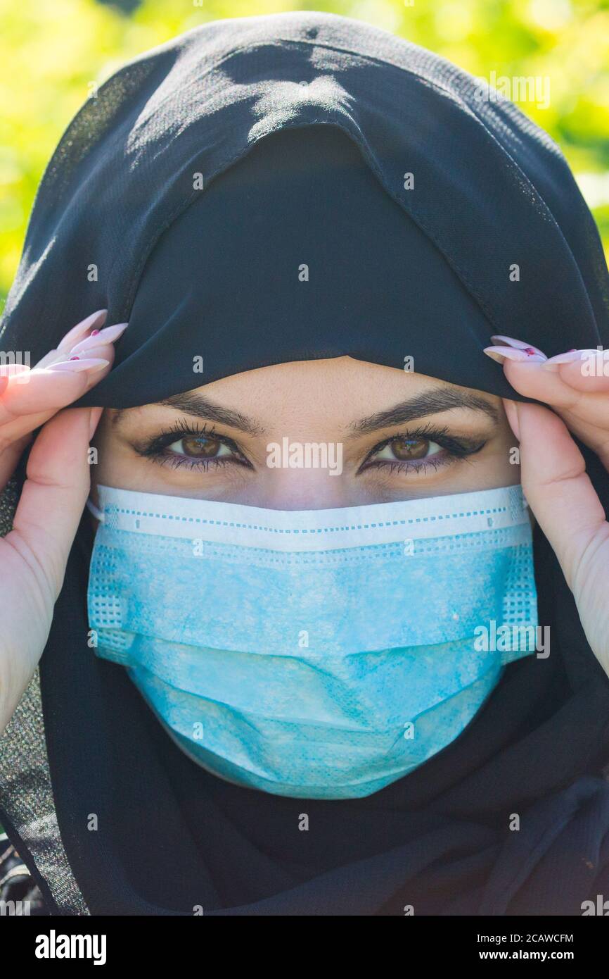 Muslim Woman With Face Mask High Resolution Stock Photography and ...