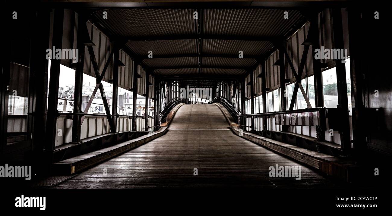 Wooden bridge covered with a metal roof Stock Photo - Alamy