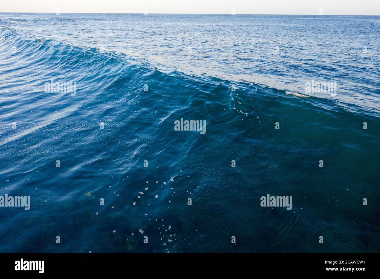 Blue ocean wave at sunset. Aerial view Stock Photo - Alamy