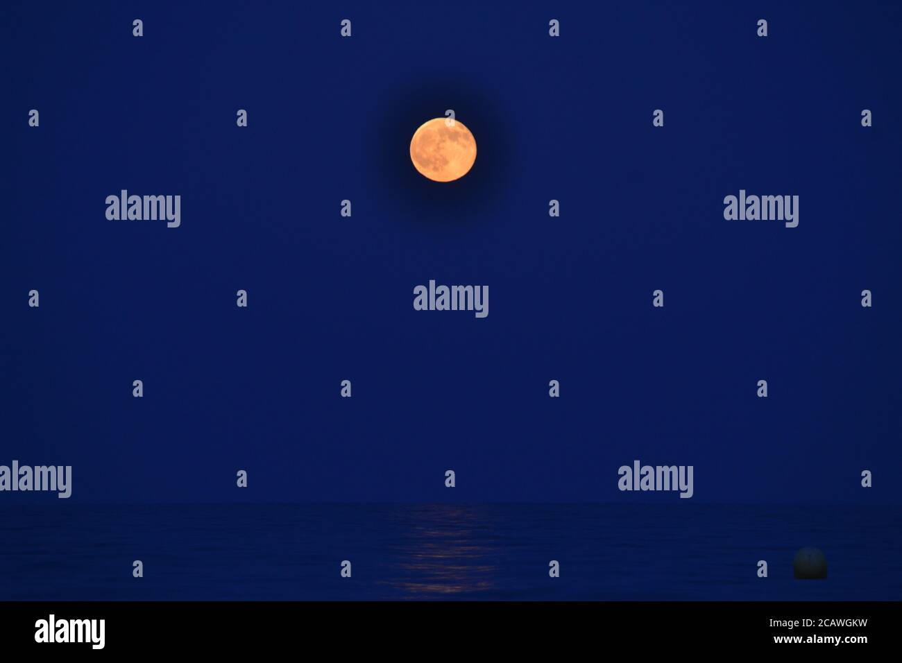 The moon rising over the horizon of the Mediterranean Sea. Photo taken ...